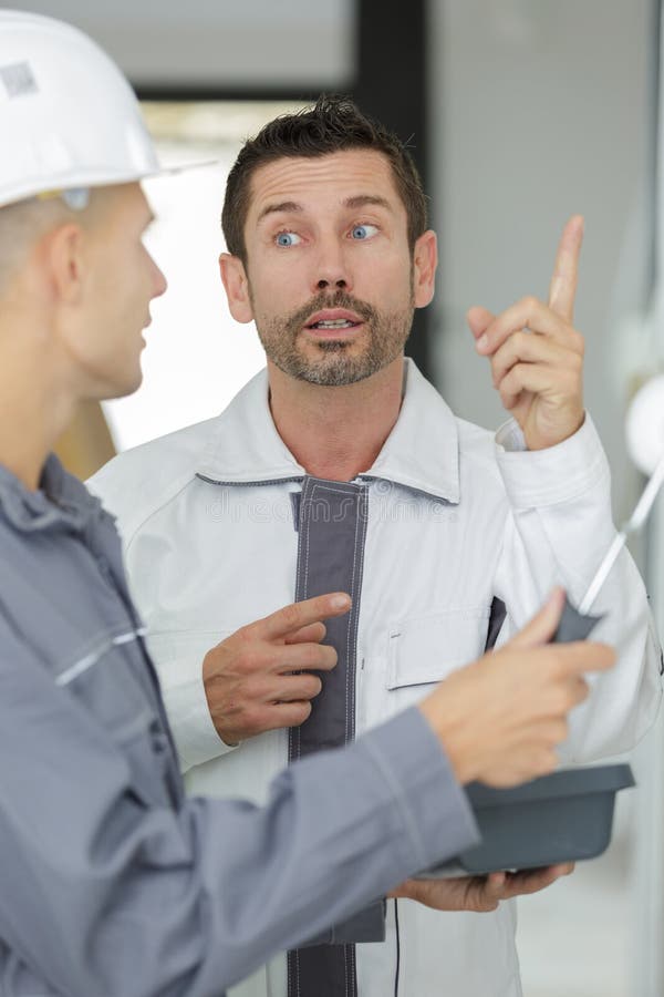 A Commercial Painter on the Stairs Spray Painting Stock Image - Image ...