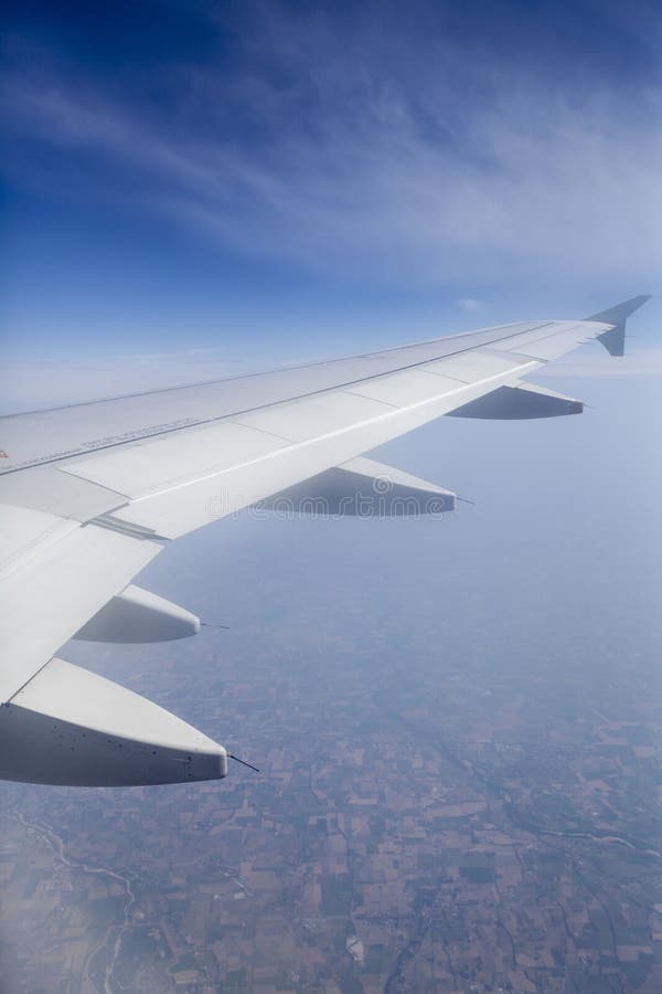 Commerical plane in flight stock photo. Image of altitude - 179843848