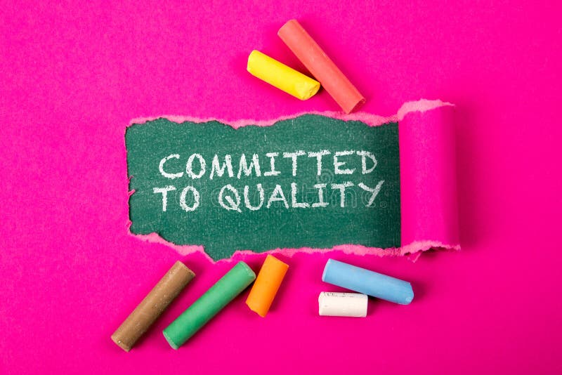 Committed To Quality. Text Under Torn Purple Paper on a Green ...