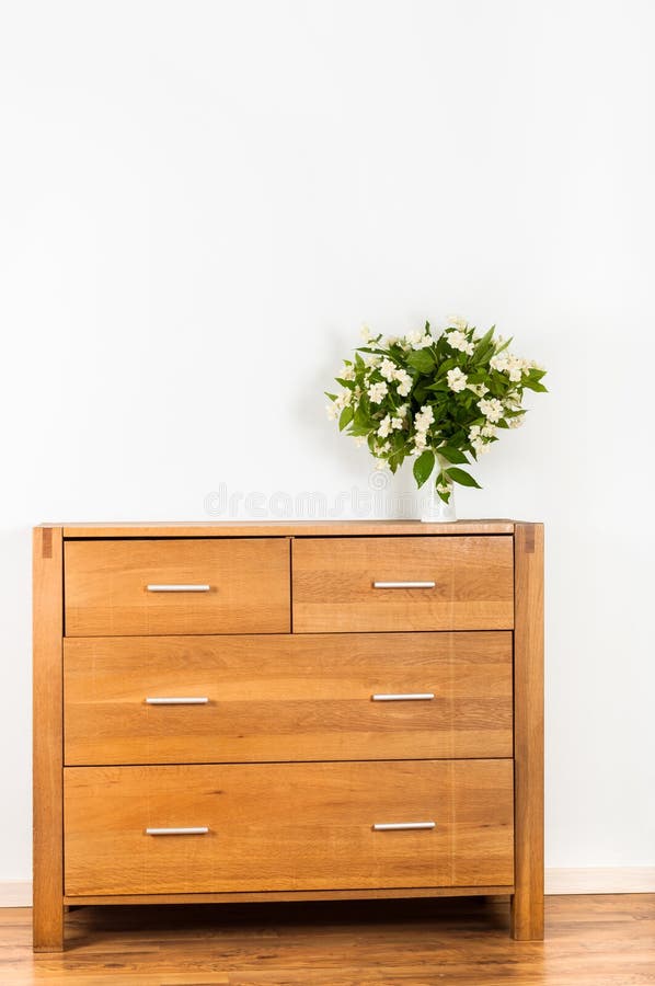 Commode with flowers stock image. Image of wall, fashion - 73766535