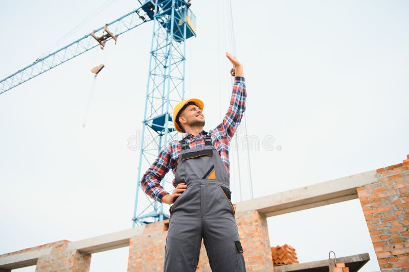 Communicating with Crane Guy. Construction Worker in Uniform and Safety ...