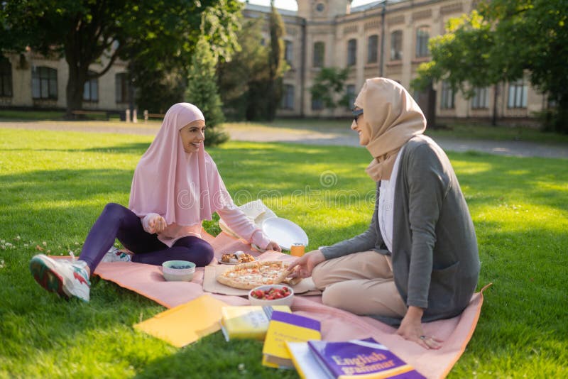 Muslim Students Communicating and Eating Lunch Outside Stock Image ...