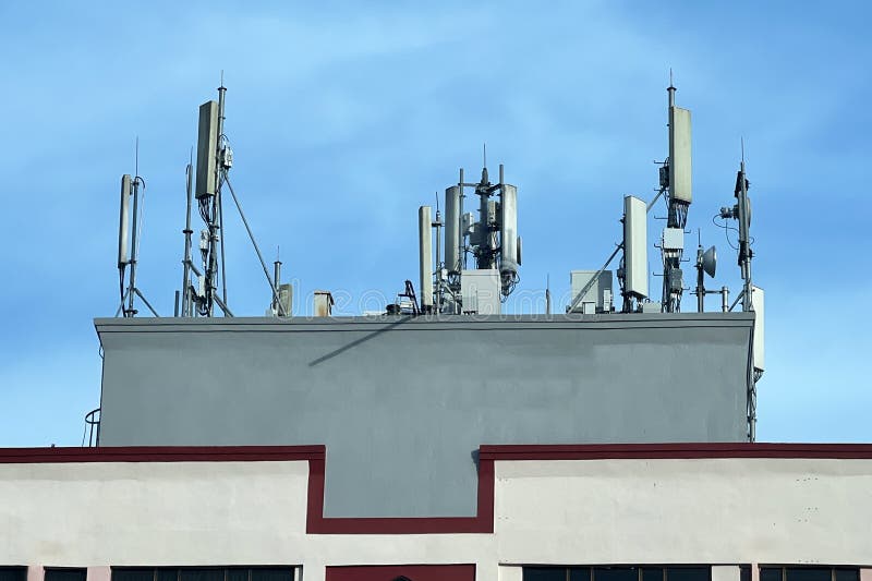 Communication Antenna on Top of the Building Stock Photo - Image of ...