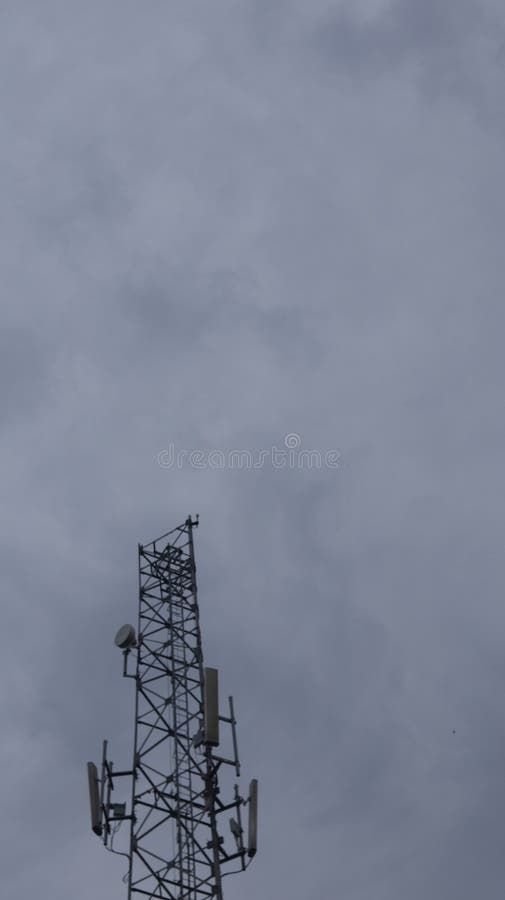 Communication Building Antenna with a Backdrop of Mountains and Sky ...