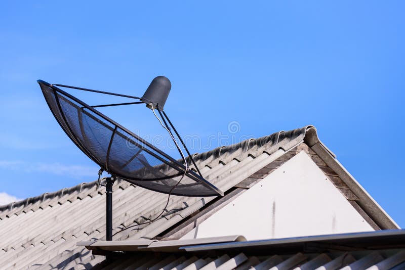 Satellite Dish on the Roof of a Wooden House.Satellite Dish is a Device ...