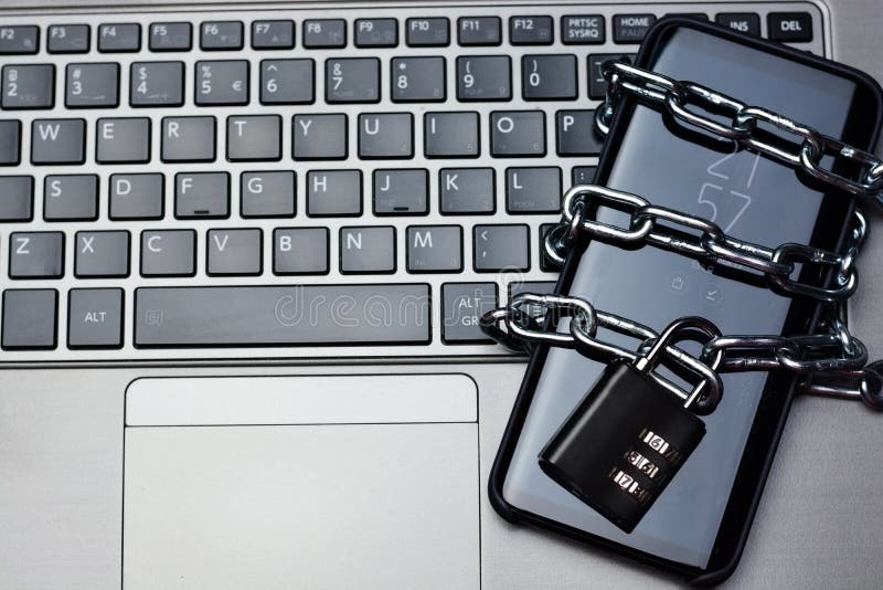 Communication Security Concept with Chain Around a Smartphone on Laptop ...