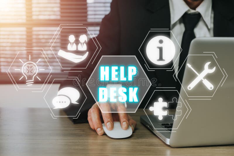 Person Using Laptop Computer on Office Desk with Help Desk Icon on ...