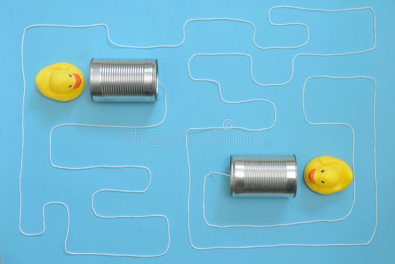 Communication Tin Can Phone with String and Yellow Toy Ducks Stock ...