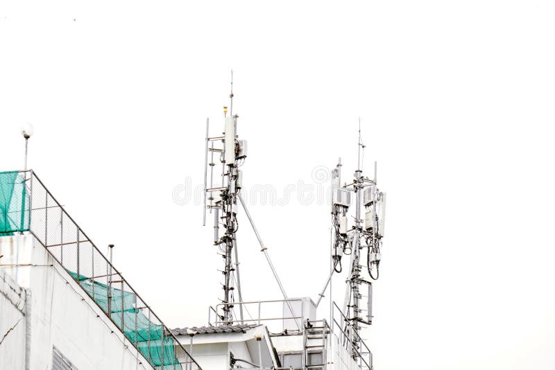 Communication Tower with Antennas on the Top of Building Isolate on ...