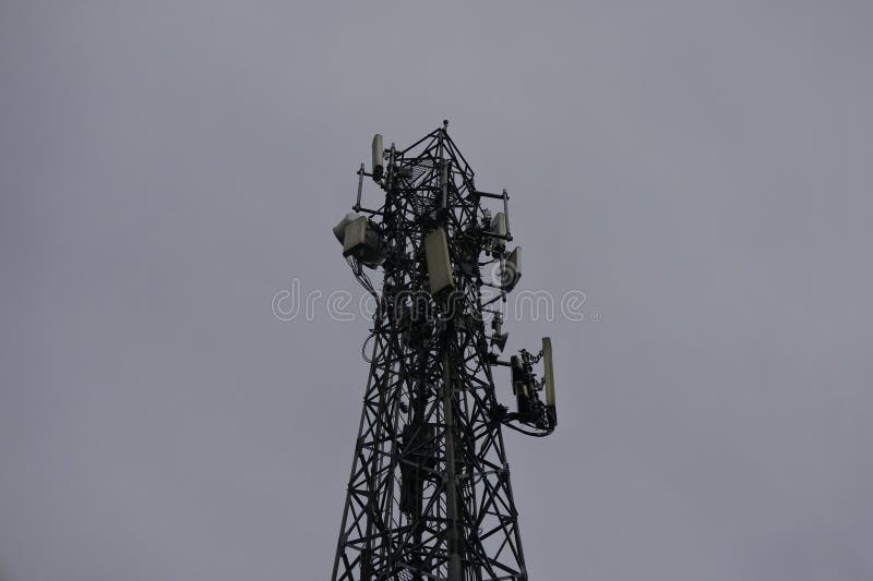 Communication Tower Below Clear Gray Sky Captured from a Low Angle ...
