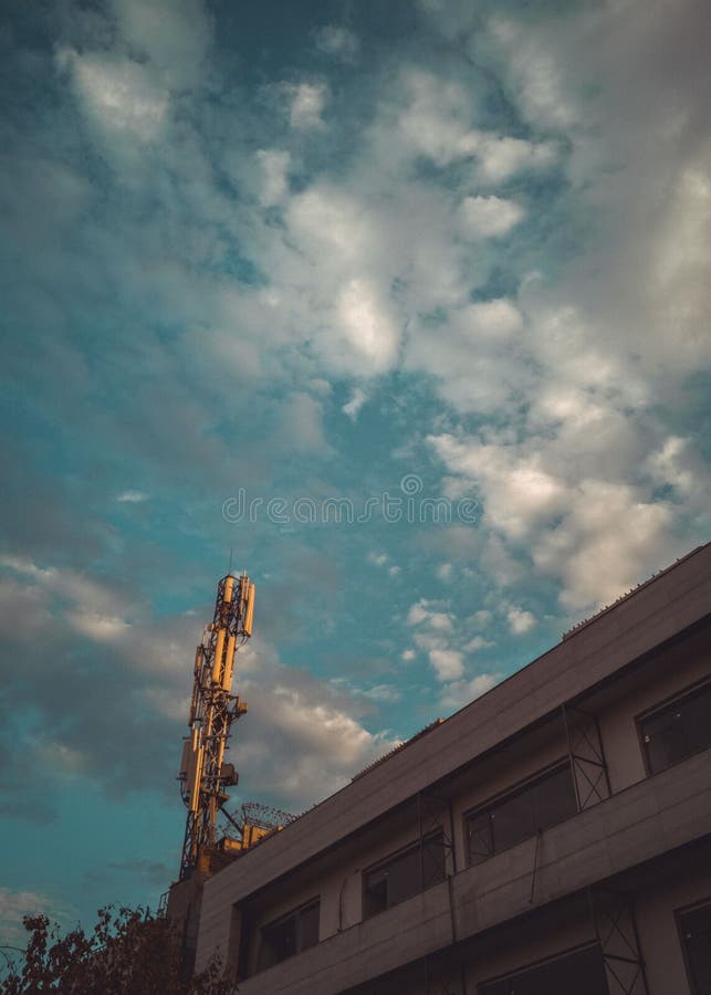 Communication Tower on a Rooftop of a Building, Vertical Stock Photo ...