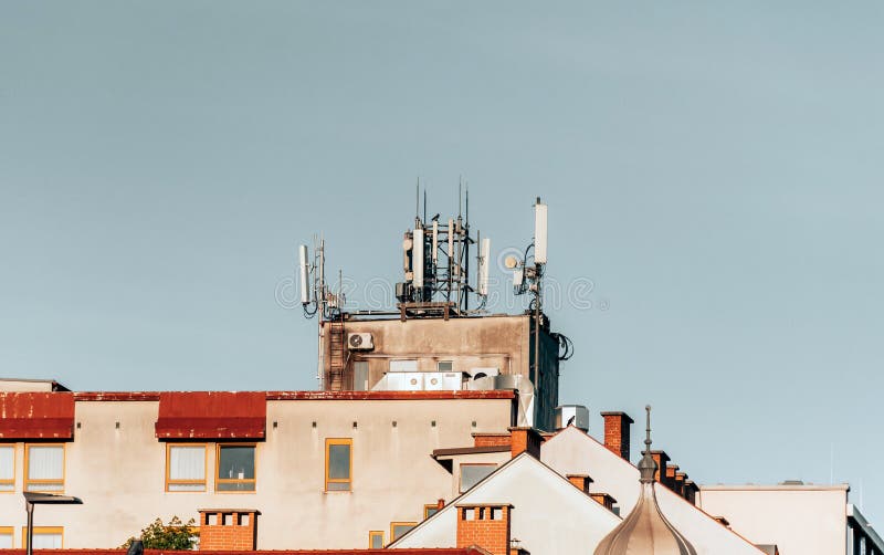 Cluster of Mobile Network Broadcast Cell Repeaters on Roof of Building ...