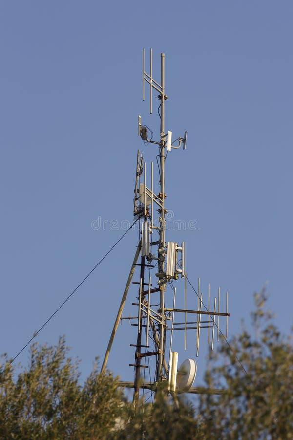 Communications Tower Gainst a Blue Sky Backdrop Stock Photo - Image of ...