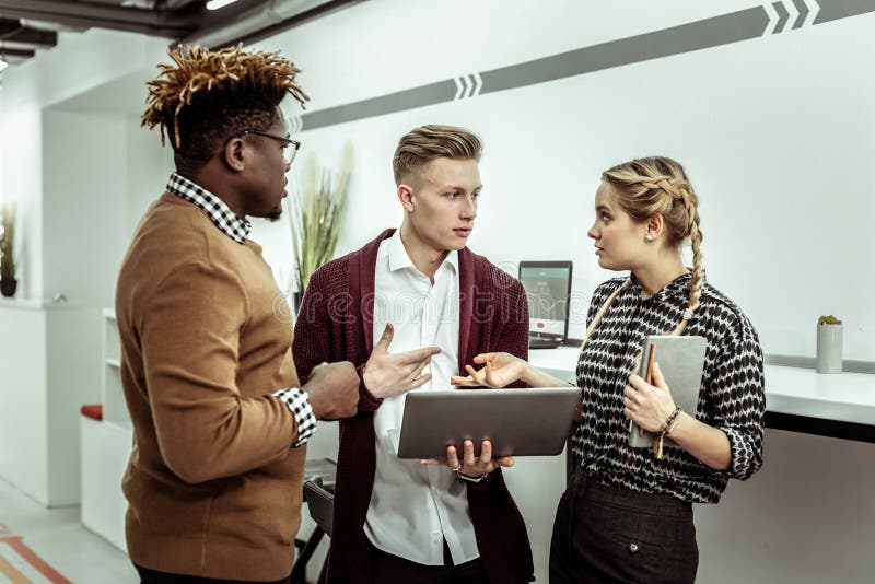Communicative Colleagues Standing in Corridor and Solving Problems ...