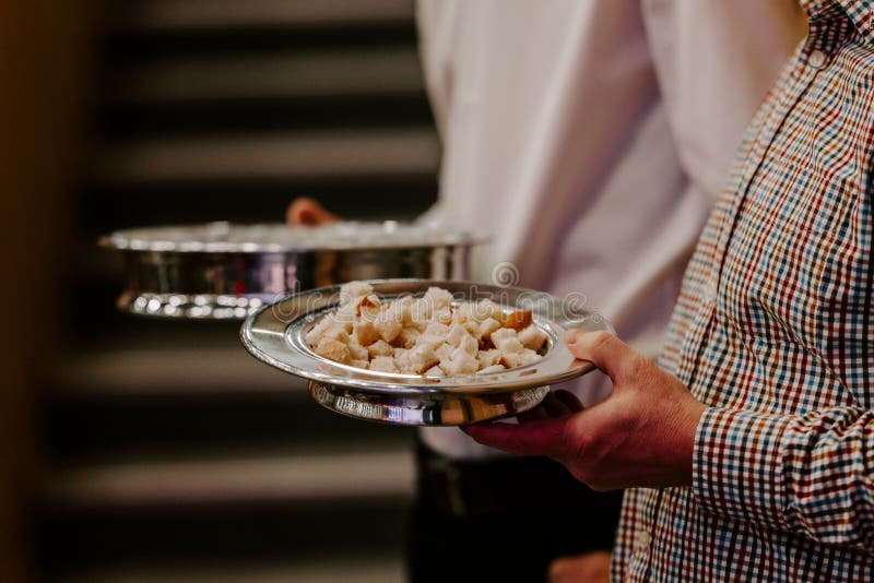 Communion with Bread and Wine during the Service in the Assembly Stock ...