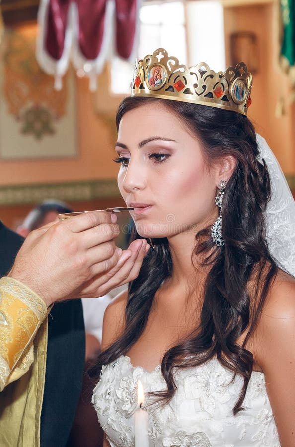 Communion of the Bride during the Wedding Ceremony Stock Photo - Image ...