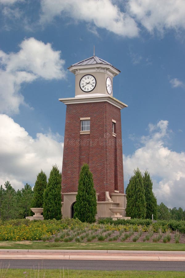 Community clock tower stock image. Image of tower, flowers - 1303883