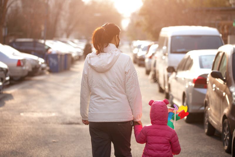 In the Community, the Mother Holding the Child Back Stock Photo - Image ...