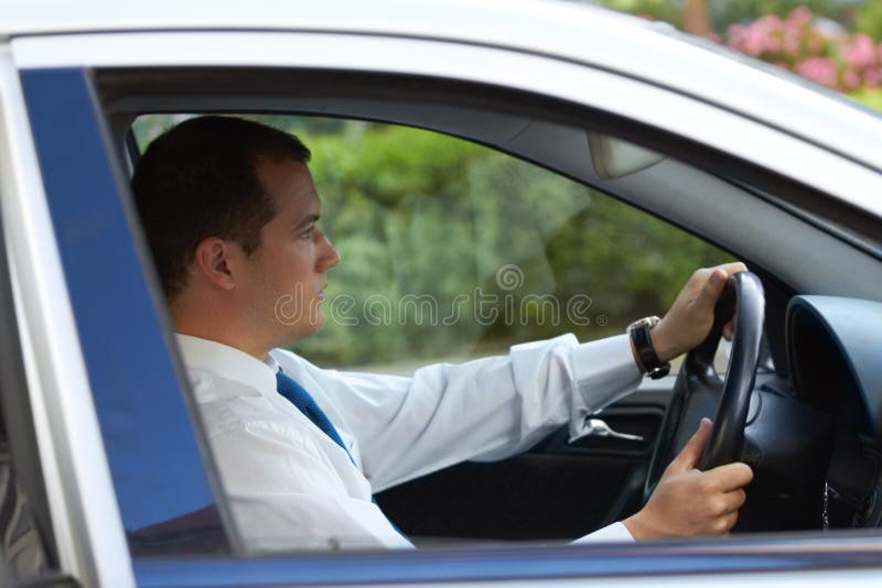 The daily Commute. Profile of a Businessman Driving His Car To Work ...