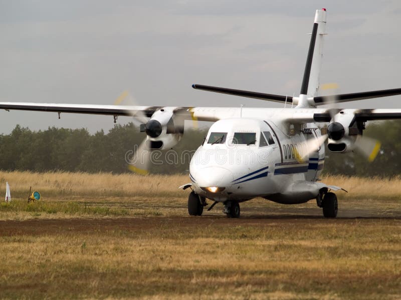 Commuter plane on taxiway stock image. Image of horizontal - 6405173