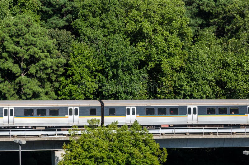 Commuter Rail Train in the Trees Stock Photo - Image of train, trees ...