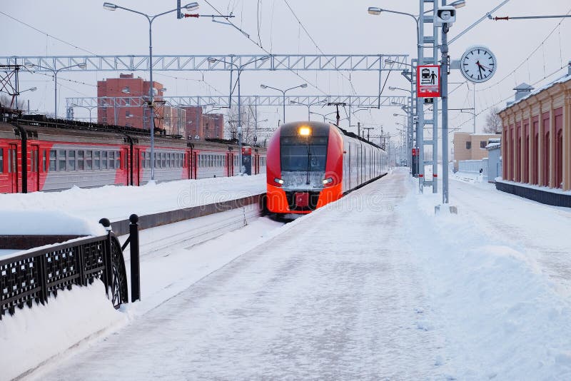 Commuter train arrives stock photo. Image of snow, winter - 109237216