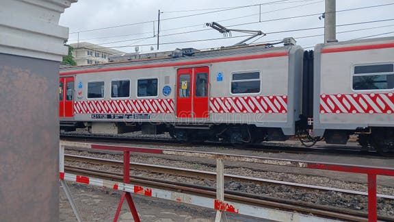 Commuter Train with a Distinctive Red and White Livery Featuring Zigzag ...