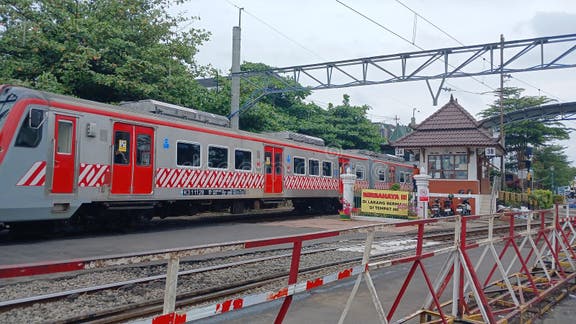 Commuter Train with a Distinctive Red and White Livery Featuring Zigzag ...
