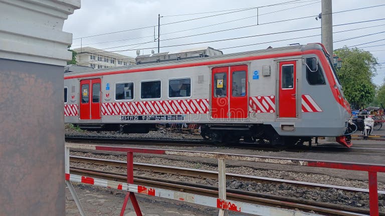 Commuter Train with a Distinctive Red and White Livery Featuring Zigzag ...