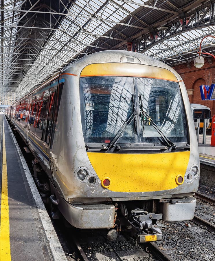 A Commuter Train at the Railway Platform about To Leave the Station ...