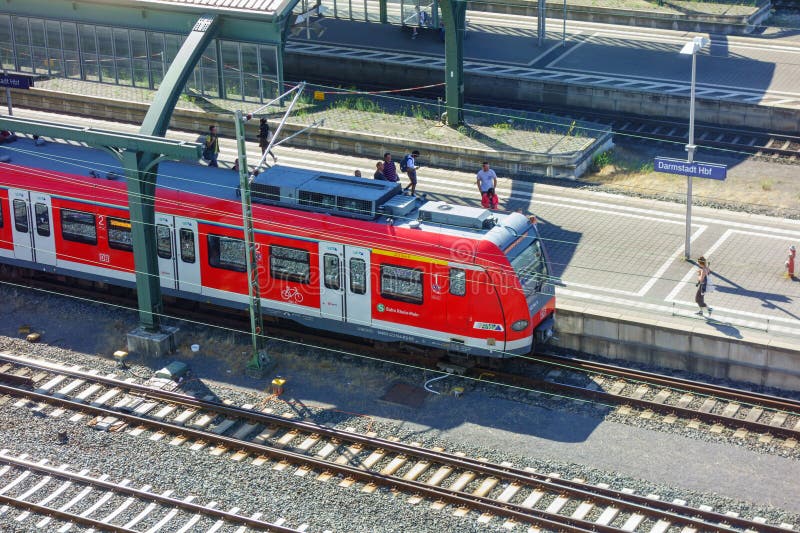Commuter Train at a Station and with Commuters Editorial Stock Photo ...
