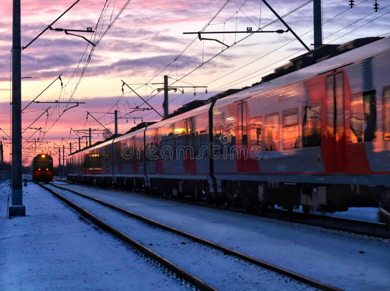 Commuter Train at Sunset in Winter Editorial Photo - Image of track ...