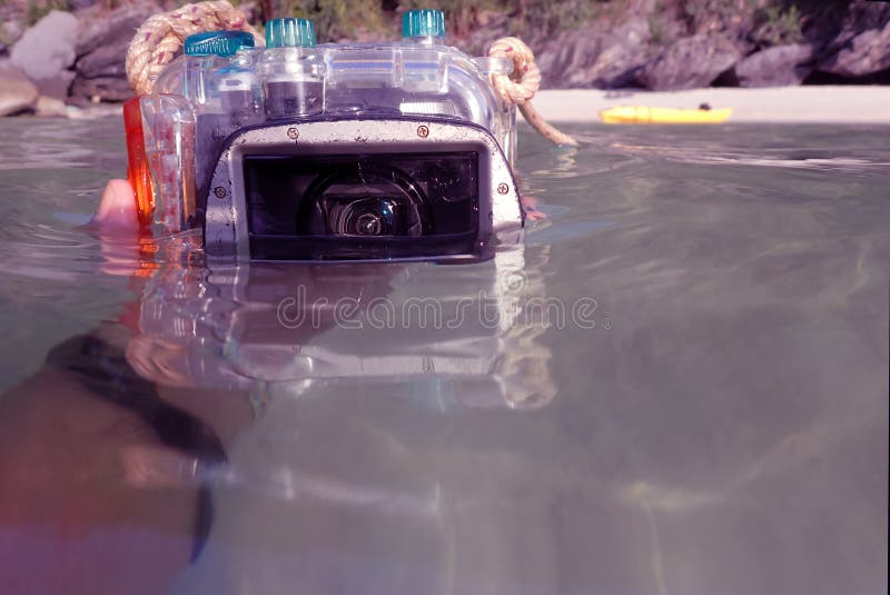 Compact Camera and Housing Floating on the Sea. Stock Image - Image of ...