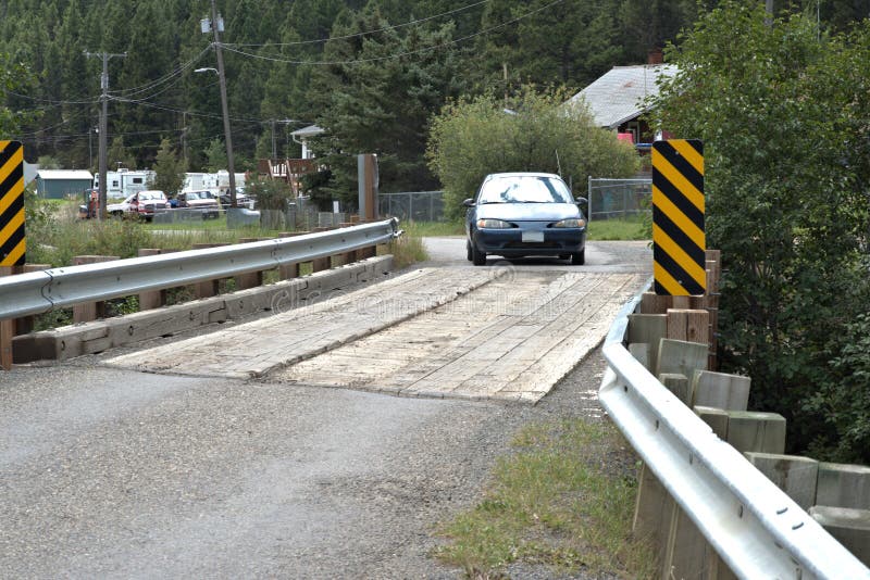 A Compact Car Crosses a One-lane Bridge Stock Photo - Image of compact ...