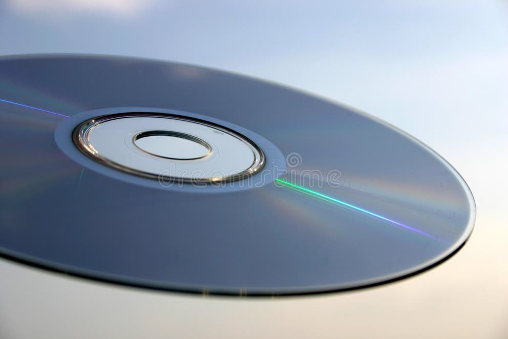 Compact Disc Close-up Against the Sky Background Stock Photo - Image of ...