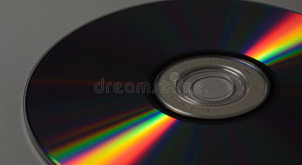 Compact Disc with a Dark Surface Reflecting Colorful Rainbow Patterns ...