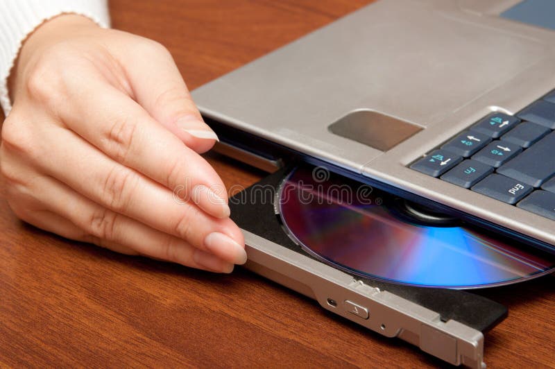 Inserting a disc stock image. Image of burning, equipment - 7780187