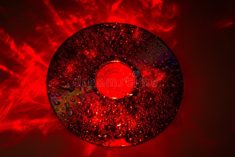 Compact Disc in the Light of Red Laser Stock Image - Image of dancing ...