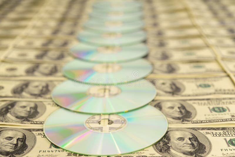 Cd-rom on pile of cash stock image. Image of bill, soft - 5027175