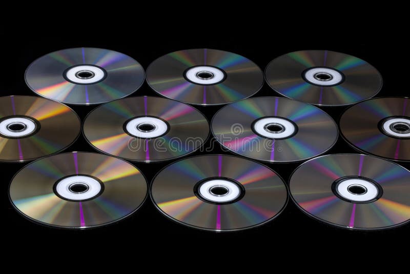 Compact Discs on a Black Background with Color Reflection Stock Photo ...
