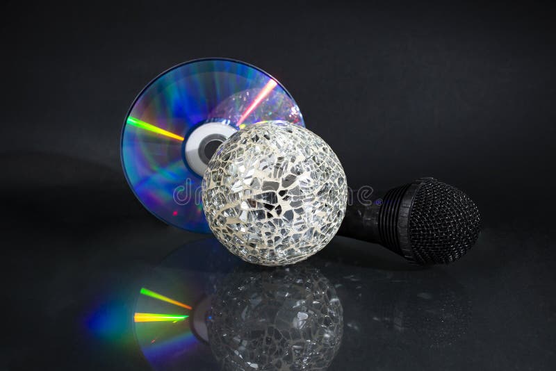 Compact Disk, Disco Ball and a Microphone on Black Backgtound, Abstract ...