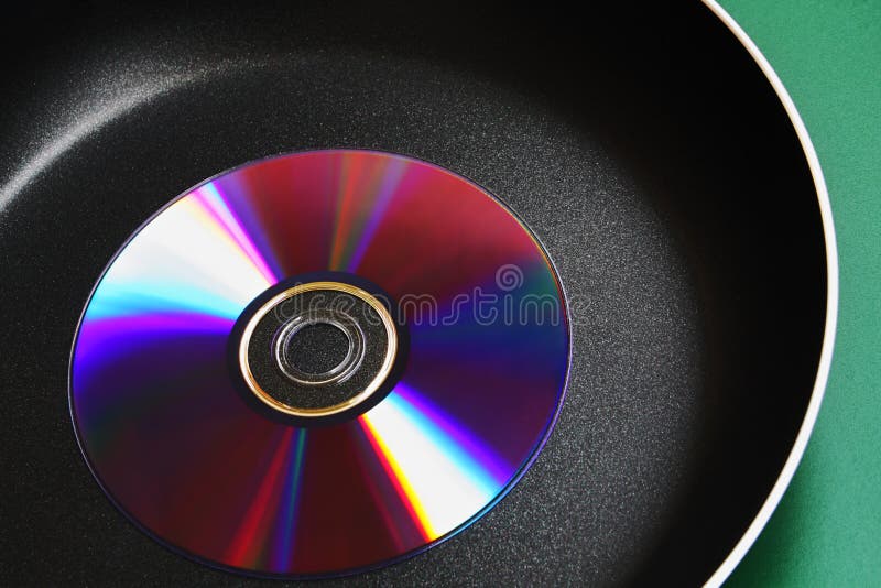 Compact disk on frying pan stock image. Image of disk - 31594843