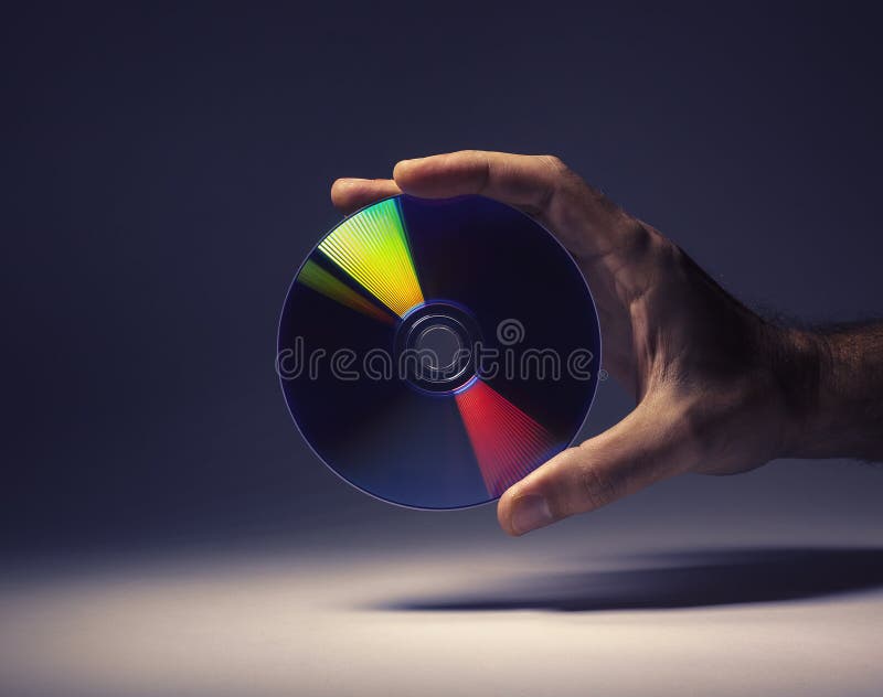 Compact Disk in a Hand stock image. Image of musical - 76847643