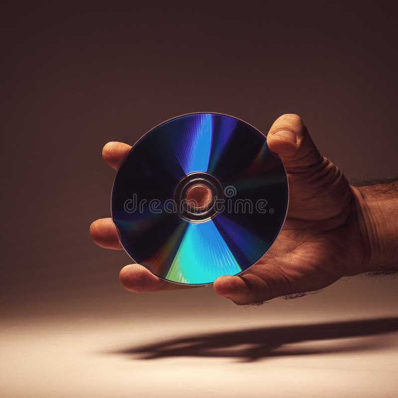 Compact Disk in a Hand stock photo. Image of fingers - 76847810