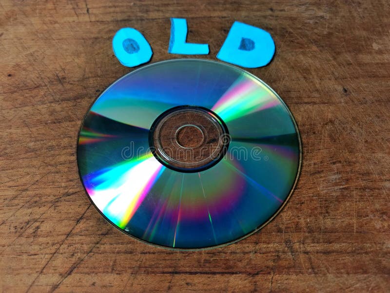 Compact Disk on Wooden Board and the Word Old. Obsolete Technology ...