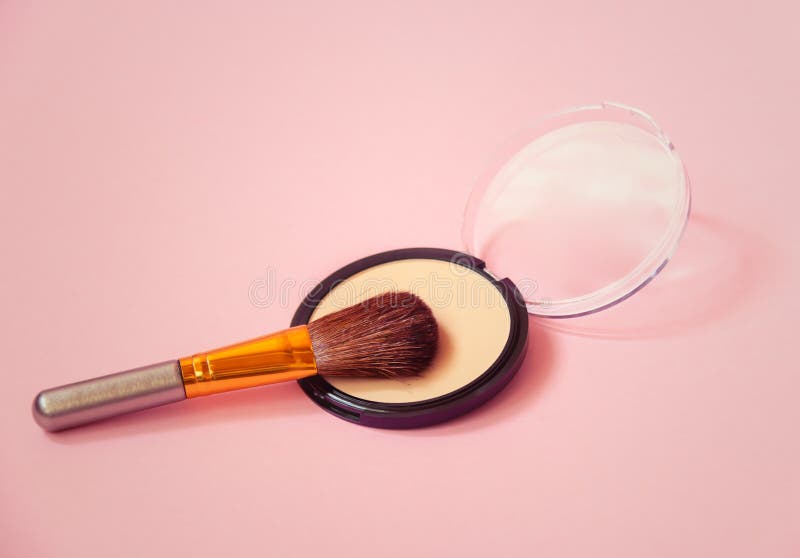 Compact Face Powder and Makeup Brush on Pink Background. Selective ...