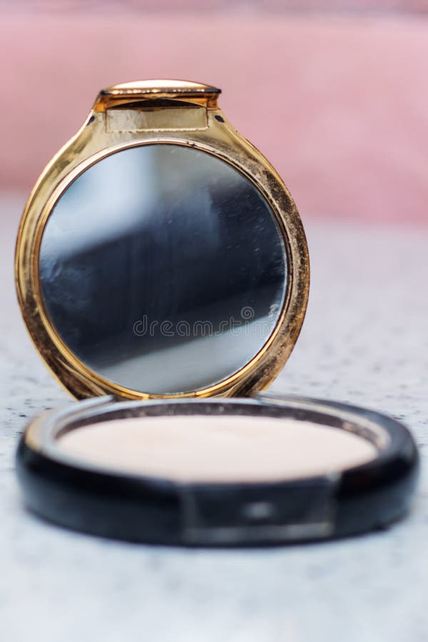 A Compact Item with a Reflective Surface on Its Upper Side Stock Photo ...