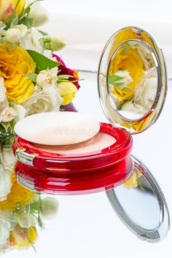 Compact powder and flower stock image. Image of powder - 55266045