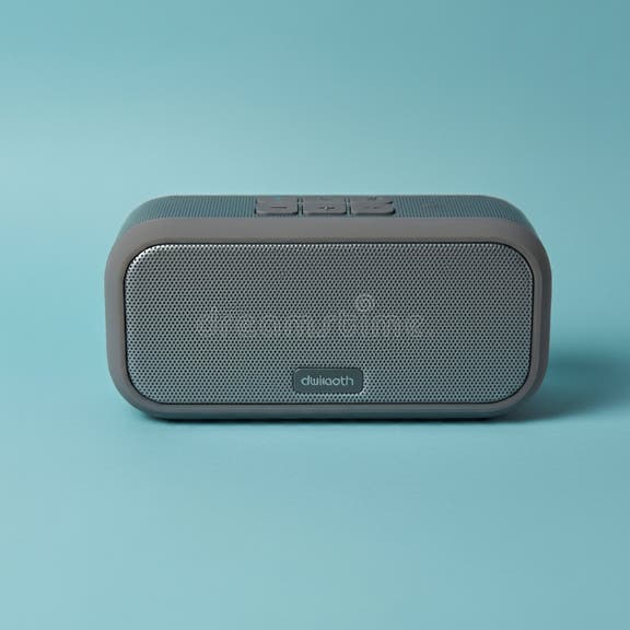 A Compact, Rectangular Bluetooth Speaker with a Gray Mesh Grille and ...