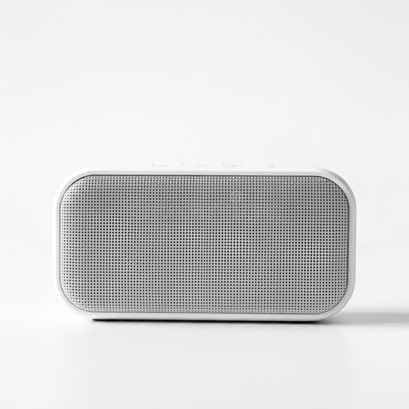Compact, Rectangular Portable Speaker with Rounded Edges, Featuring a ...